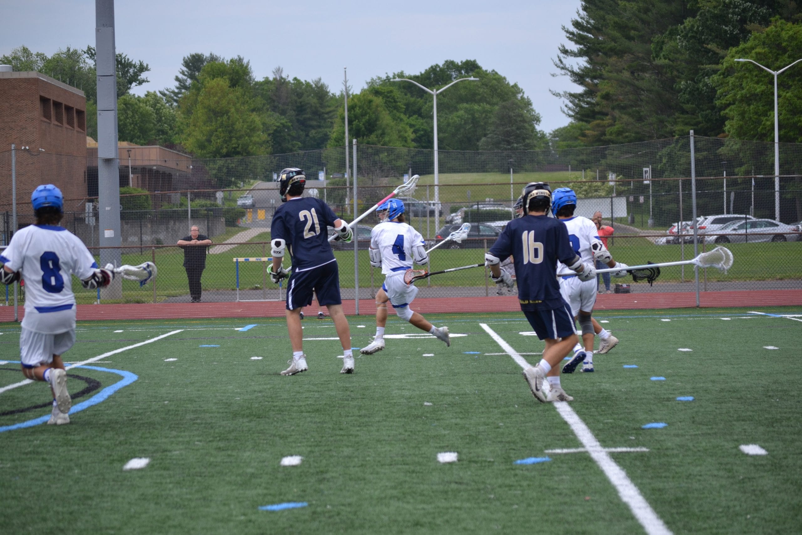 Logan Murphy (#4) Of Hall Gets Off A Shot Ahead Of A Newington Defender ...