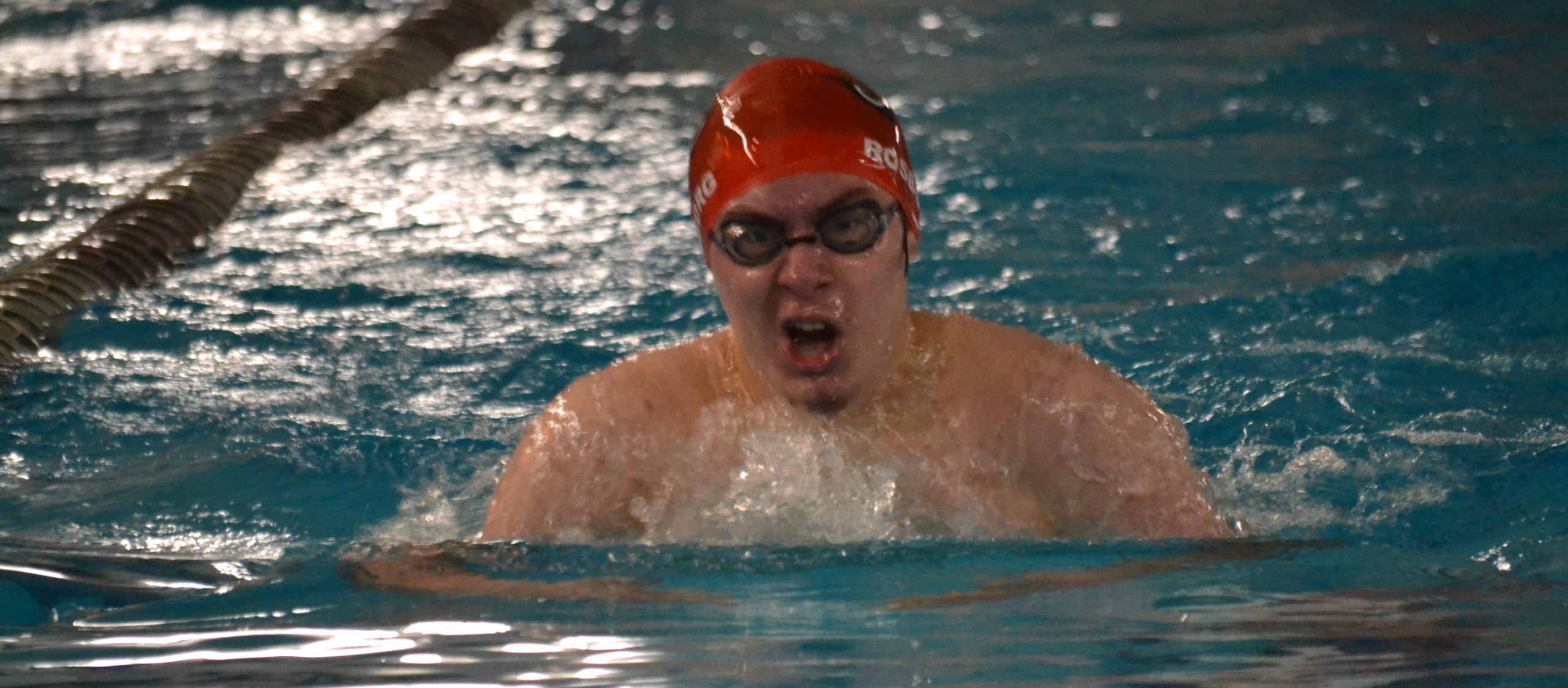 Jeffry Rosborg competes in the 100-Yard Breastroke for Conard - We-Ha ...
