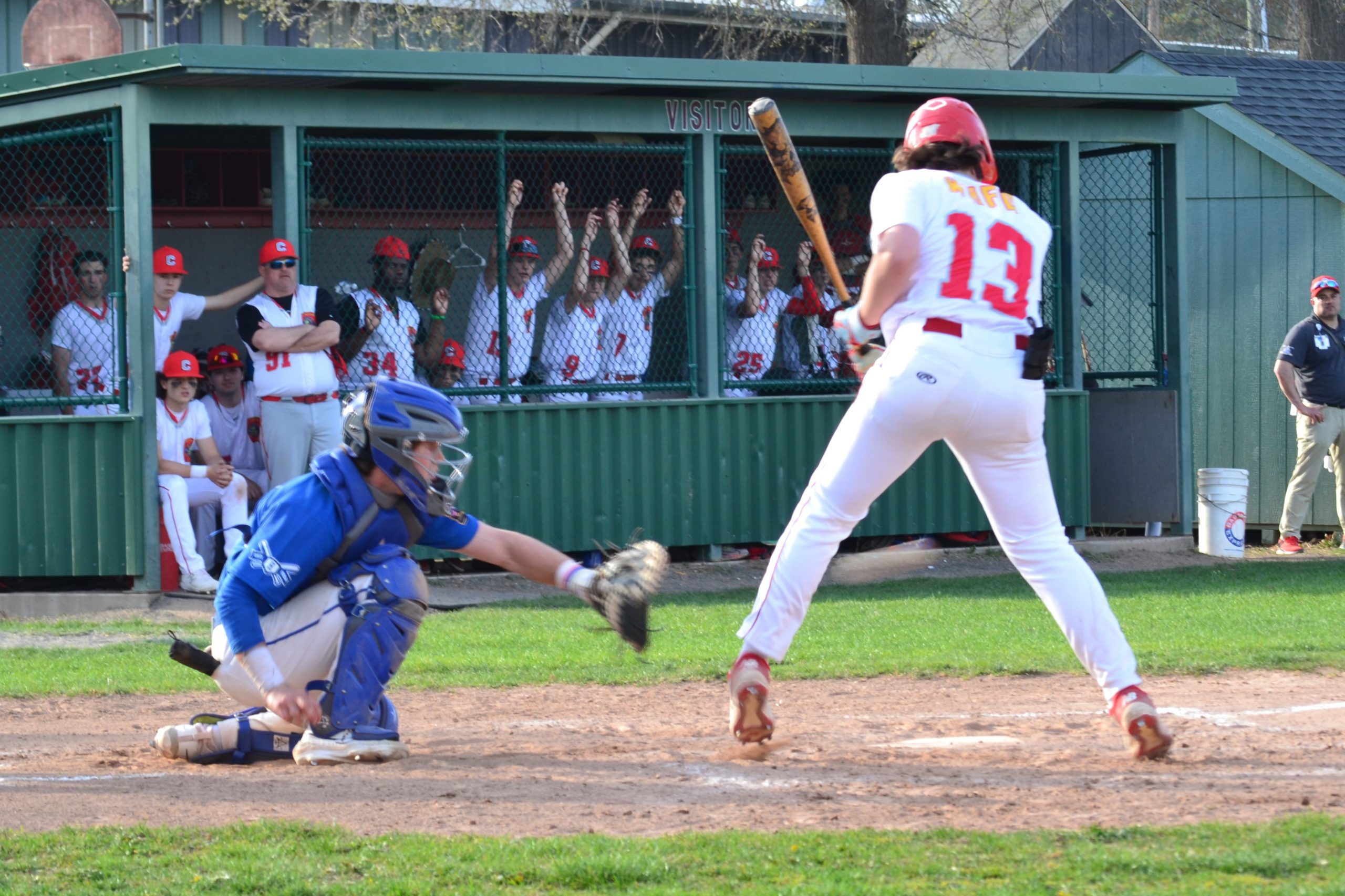 Tristan Baron gets out of the wy of the pitch as Hall catcher Tyler ...