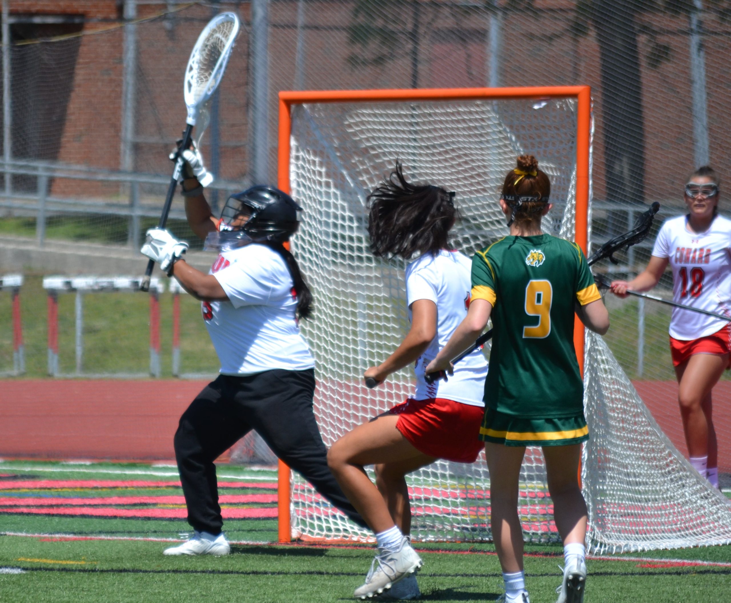 Freshman goalie Maya Nanayakkara makes the save for Conard in the win ...