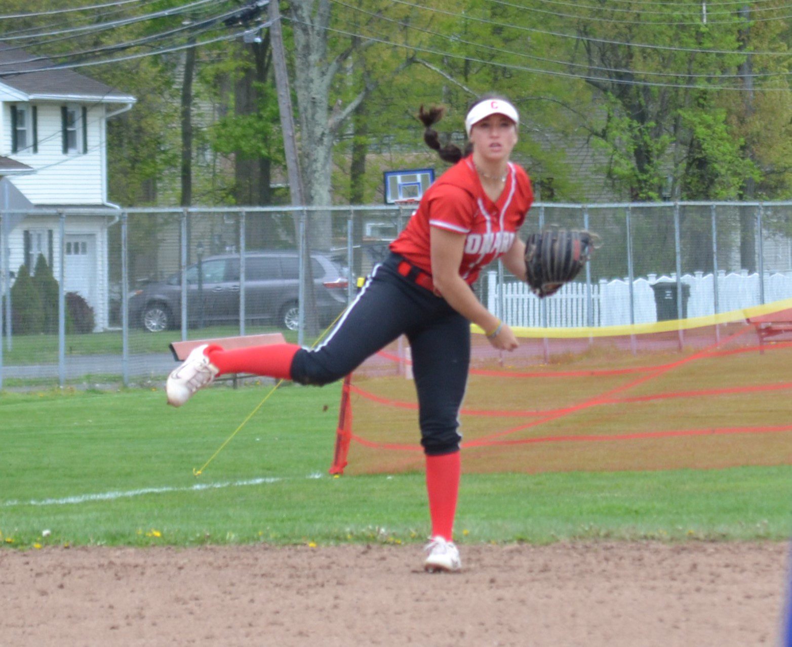 Shortstop Sadira Forcucci follows through on her throw to first base ...
