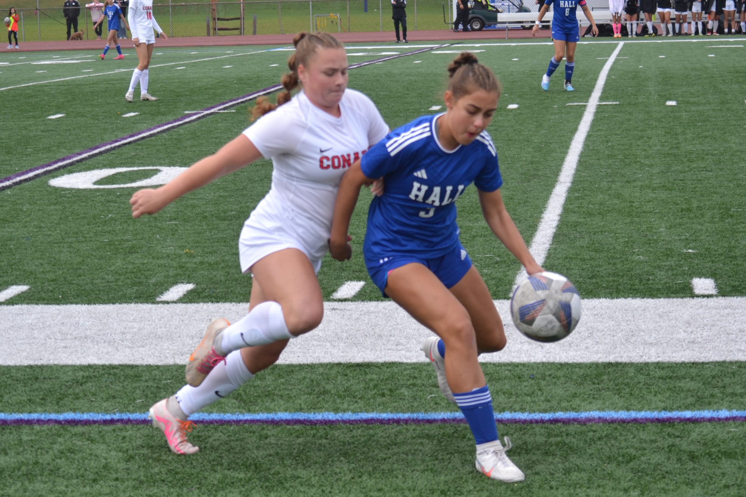 Leah Berey of Hall tried to shield Conard's Taylor Yepes from the ball ...