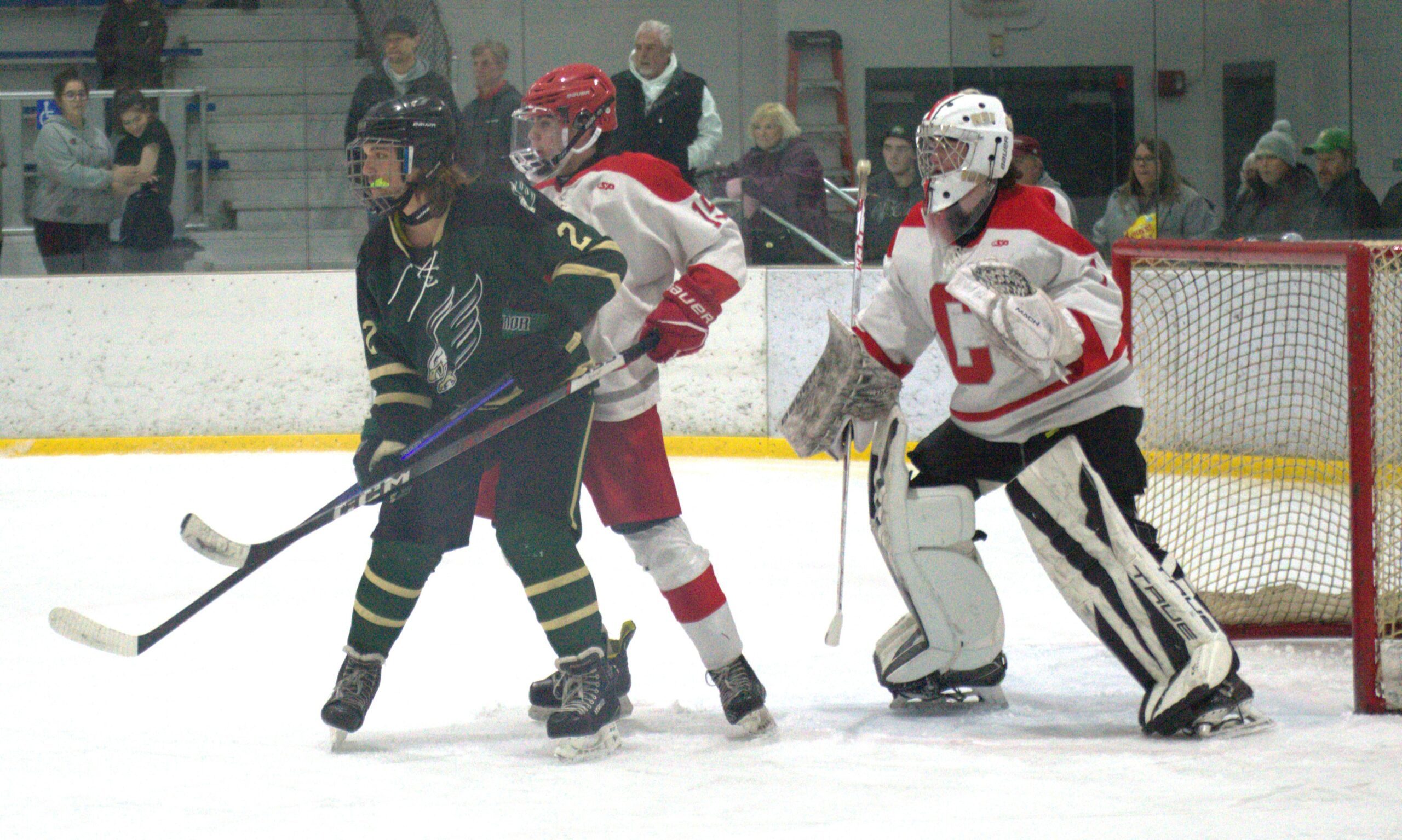 Dylan Smith keeps Sawyer Pequita away from his goal and goalie Blake ...