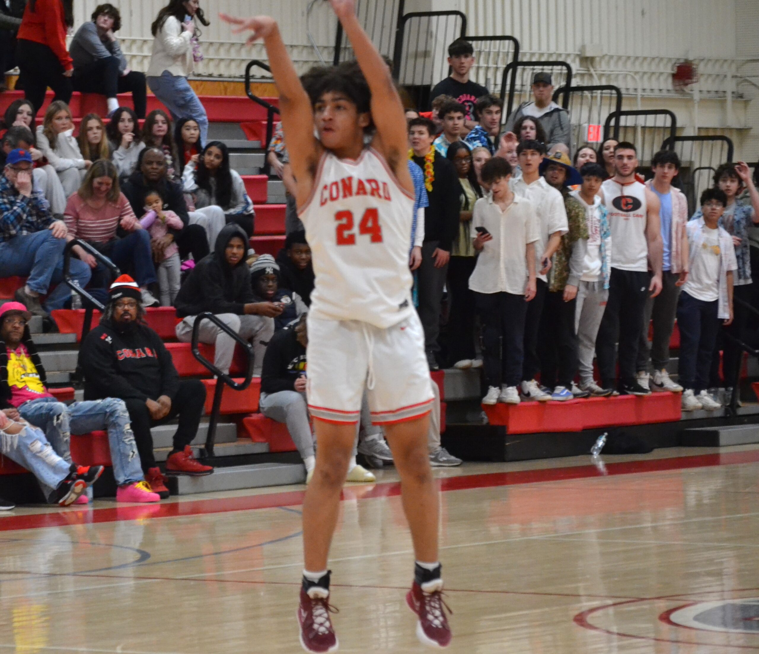 Senior Julius Goode follows thru on his shot - We-Ha | West Hartford News
