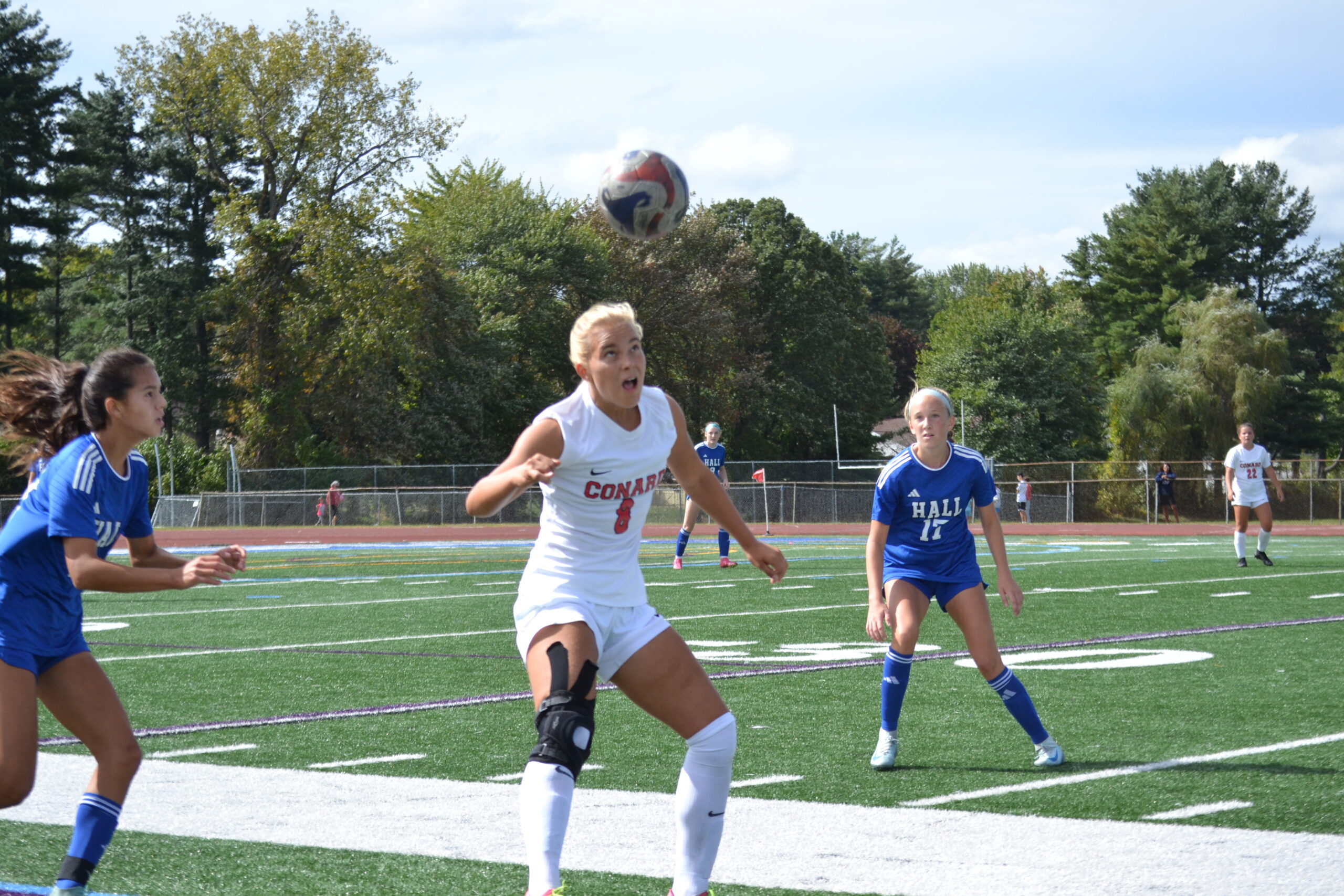 Alice Araya of Conard flicks the throw in to a teammate - We-Ha | West ...