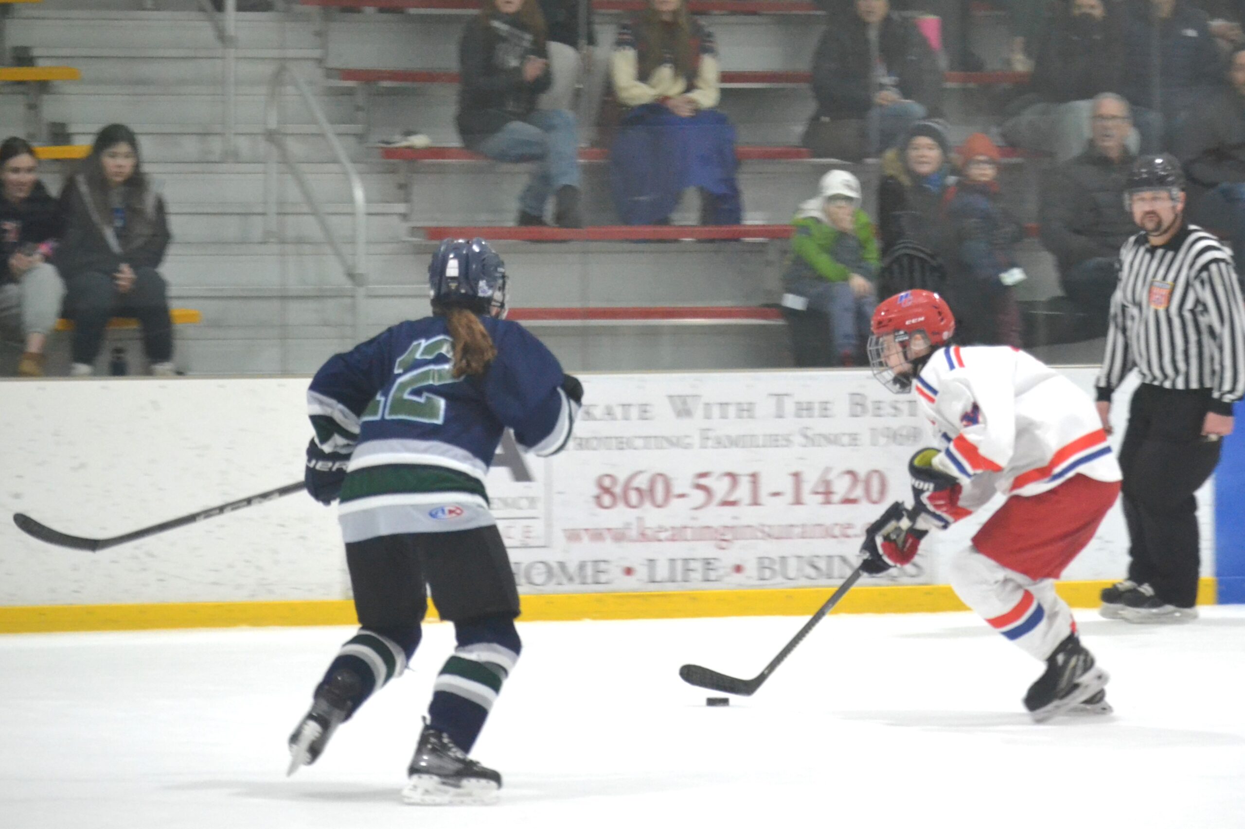 Danielle Healy (12) closes in on Claire Reidel as she shoots from the ...