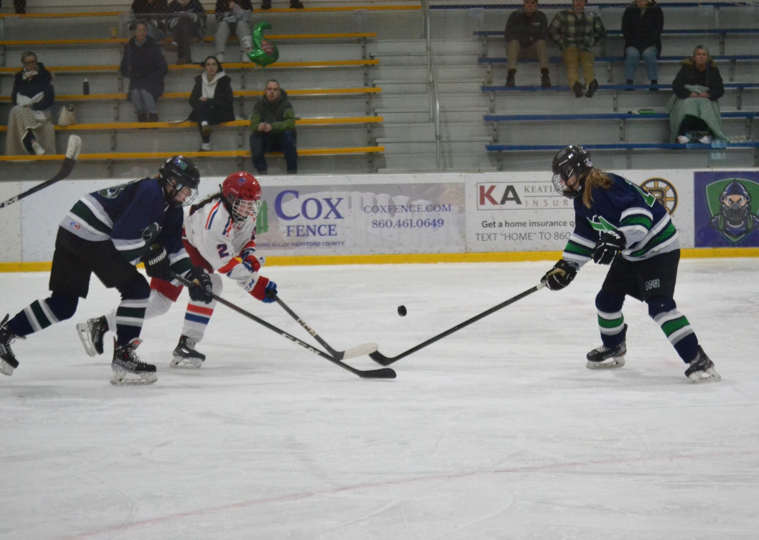 Teagan Cohane (2) battles with two Mercy players for control of the ...