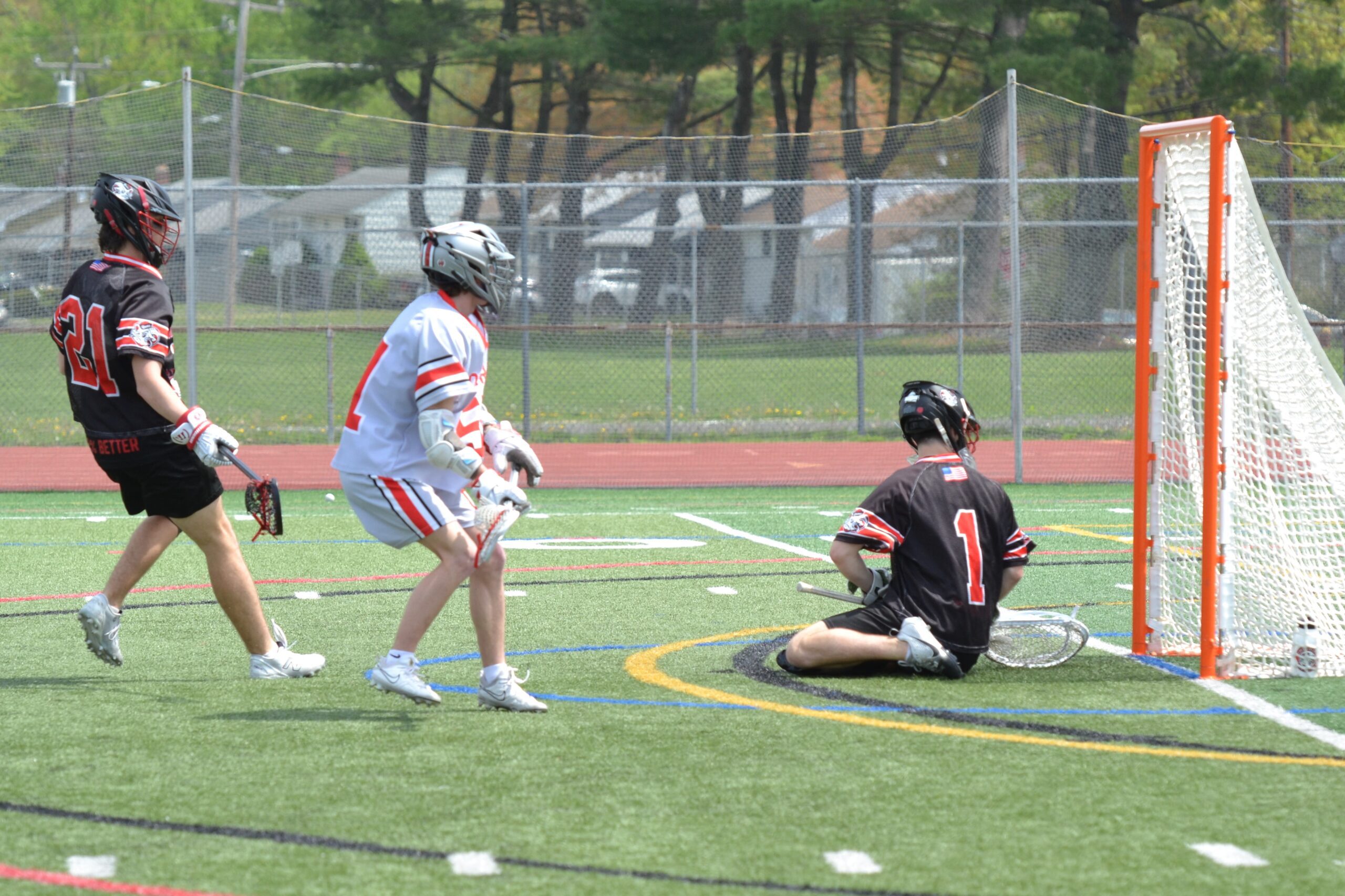 Brady Cersosimo and Cheshire goalie Joe Grenier look into the net after ...