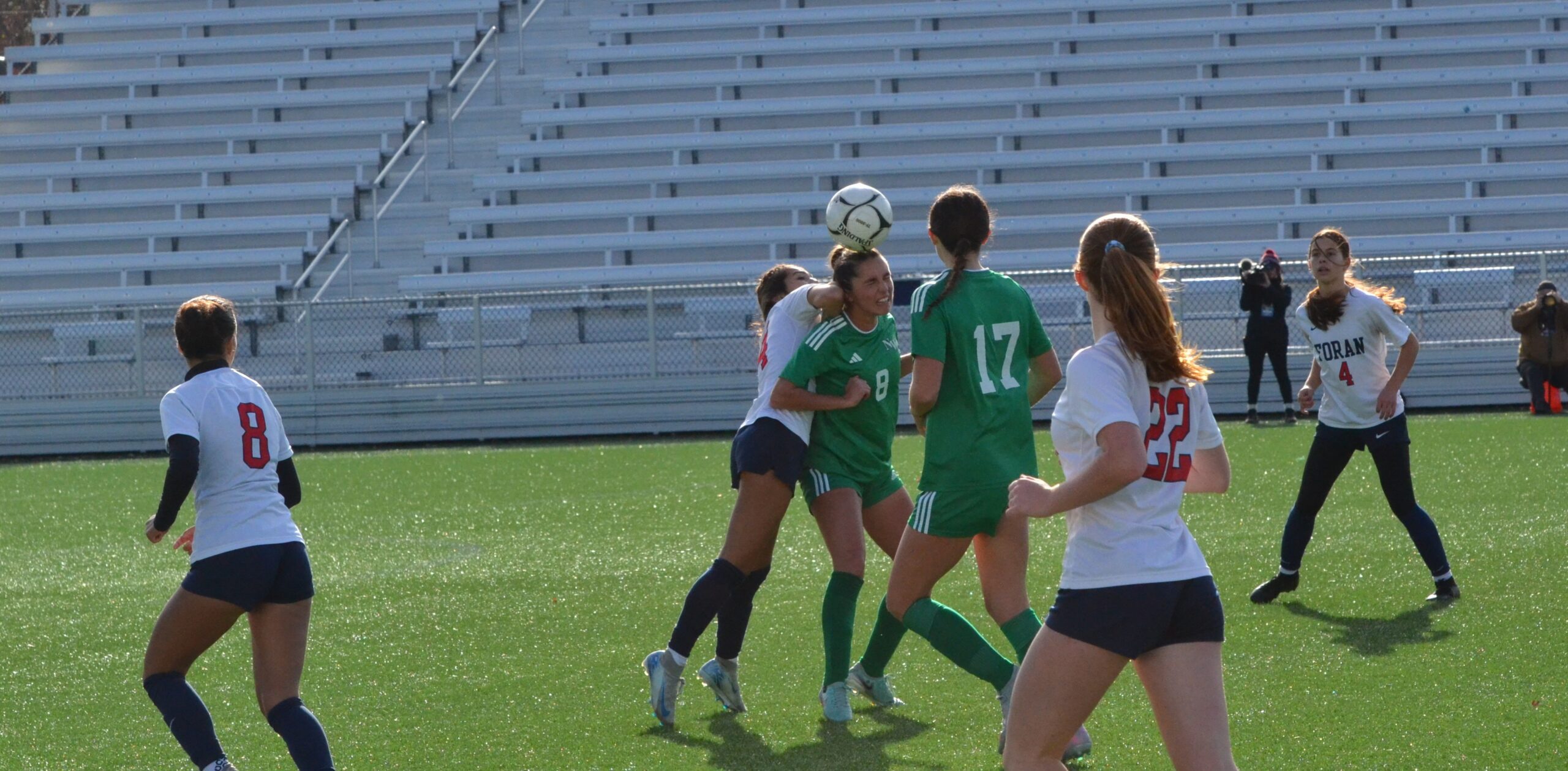 Madeline Rudy (8) gets the ball in the front of her head, and the ...